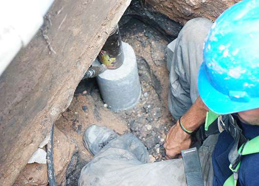 Tunnel or excavate under concrete slab