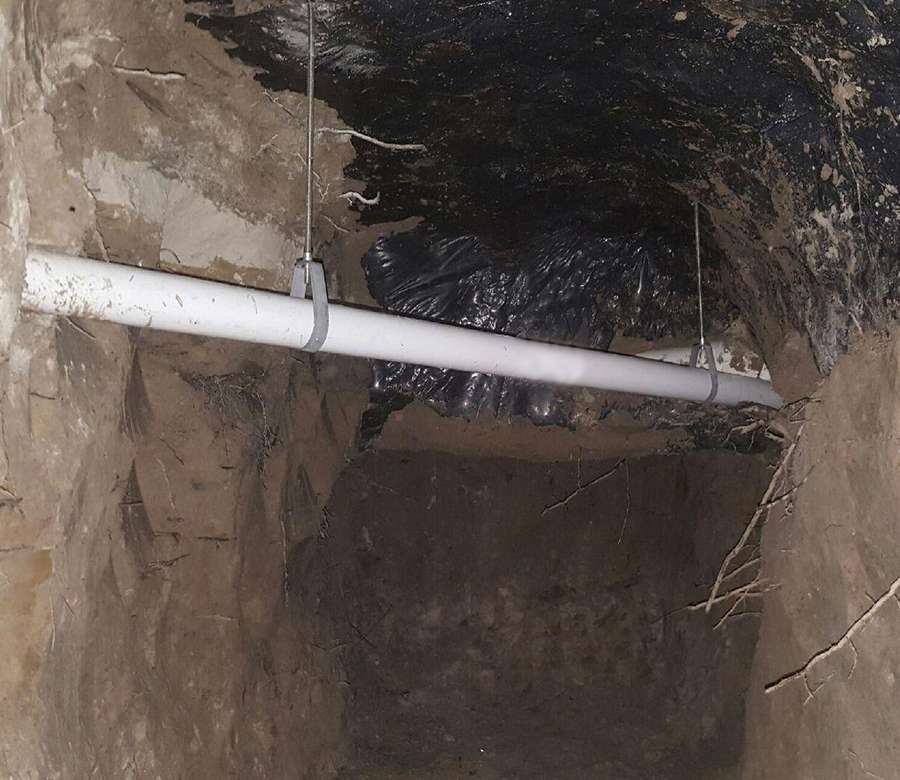 Tunnel or excavate under concrete slab